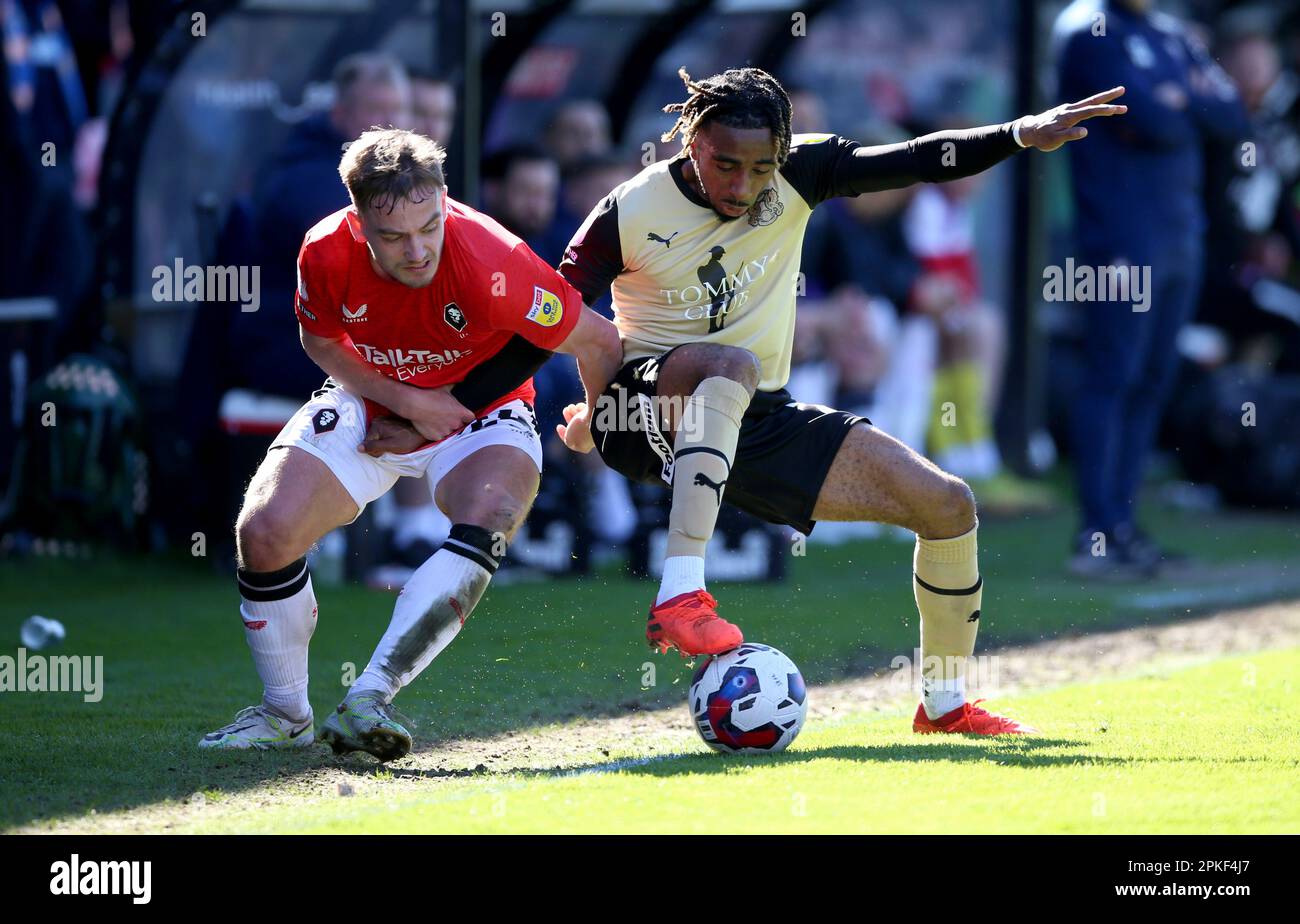 Salford City’s Luke Bolton battles for the ball with Leyton Orient’s ...