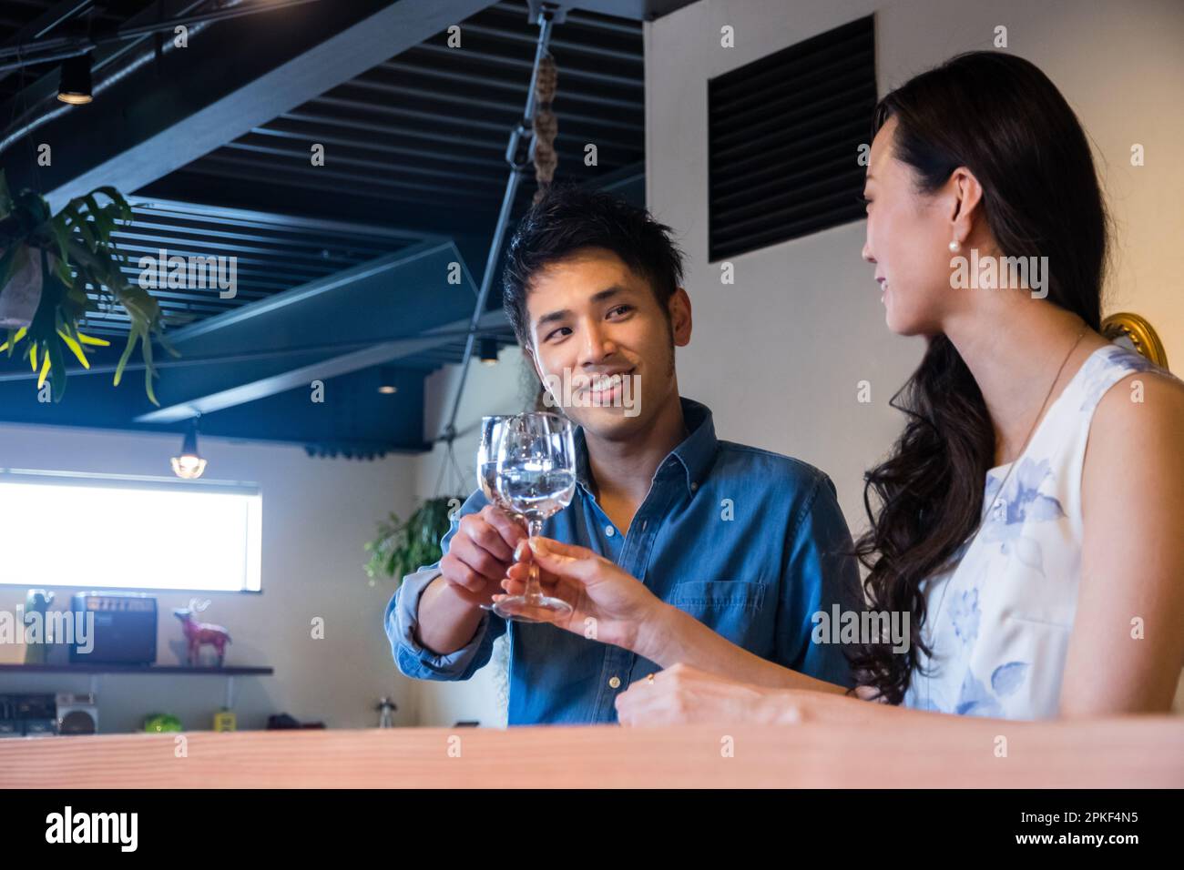Men and women relaxing in a cafe Stock Photo - Alamy