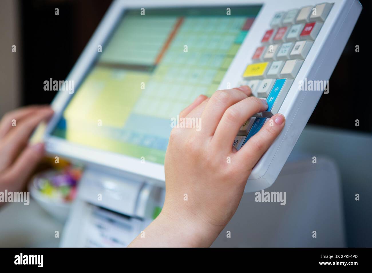 A café worker working the cash register Stock Photo - Alamy