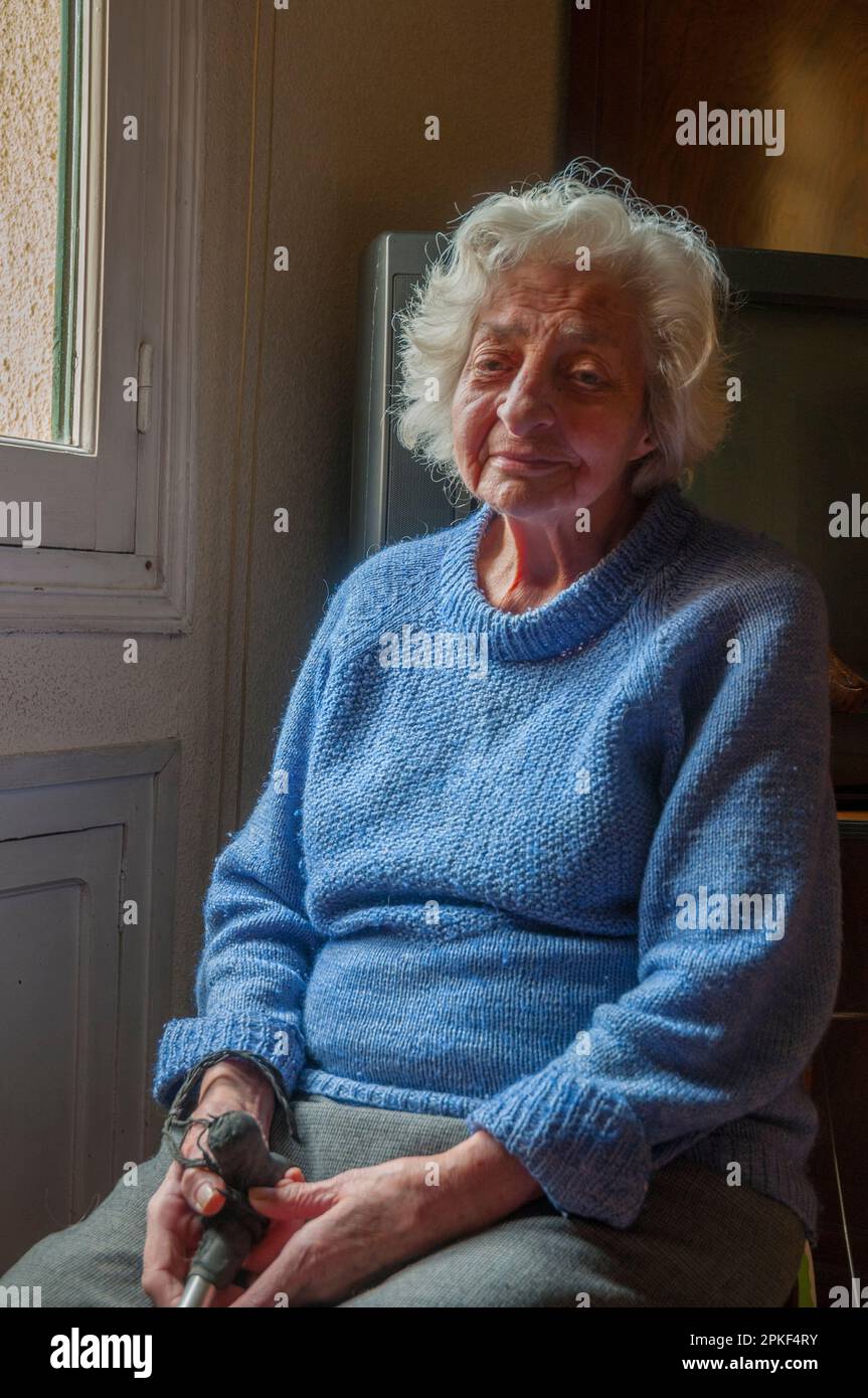 Old lady sitting by the window Stock Photo - Alamy