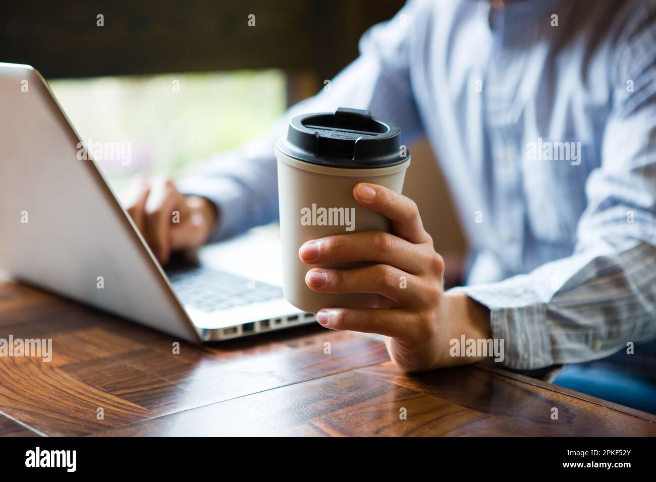 Men using computers at a café Stock Photo - Alamy