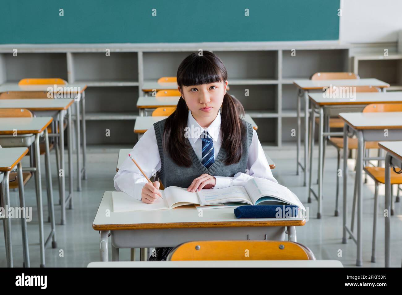 Junior high school girls studying in a classroom Stock Photo - Alamy