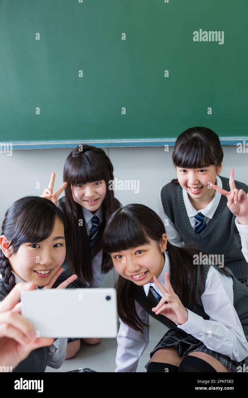 Junior high school girls who get along well with each other Stock Photo ...
