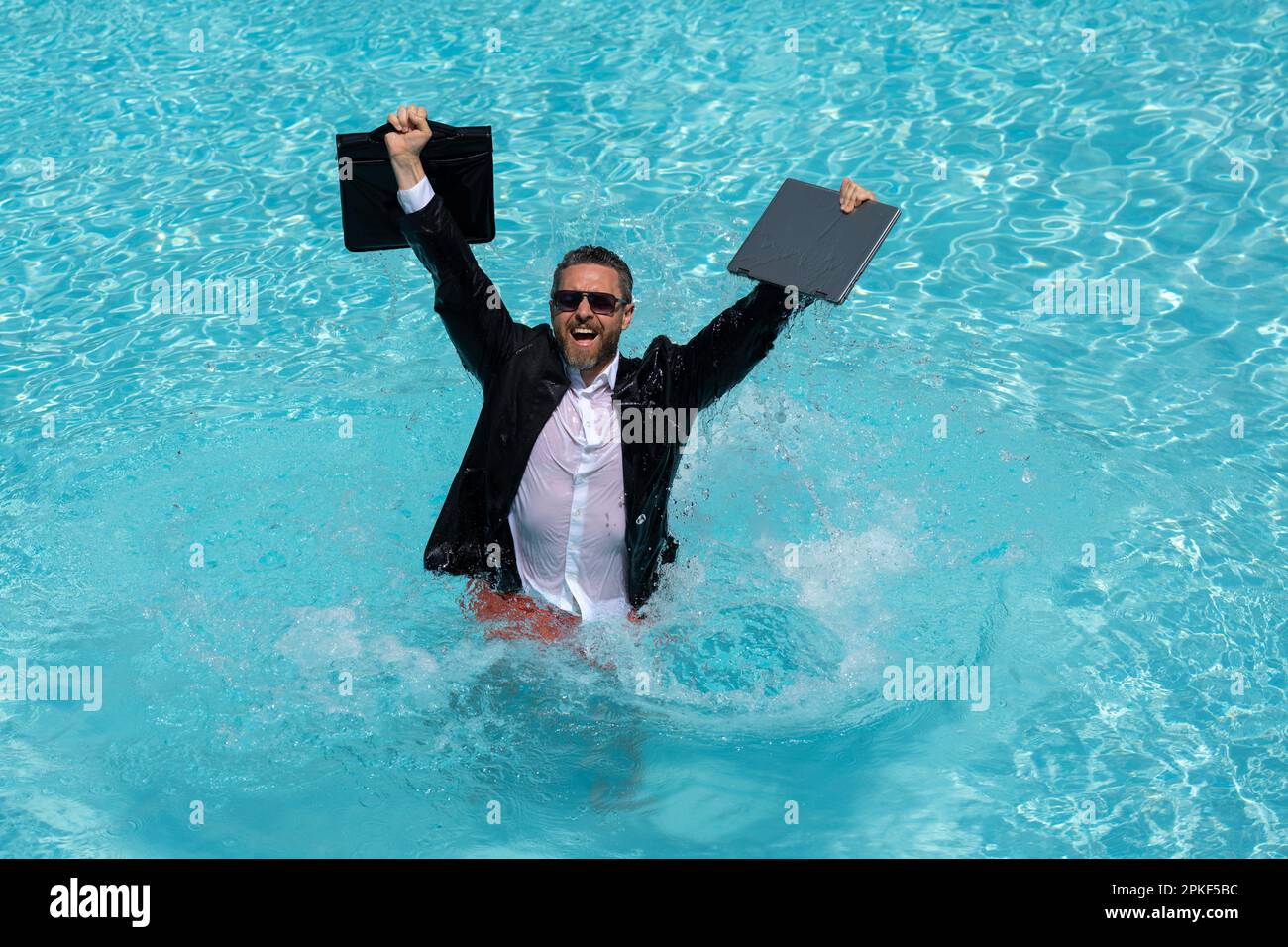 Successful business man in suit in pool water. Business man in suit ...