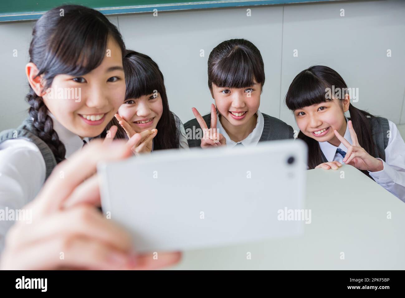 Junior high school girls who get along well with each other Stock Photo ...