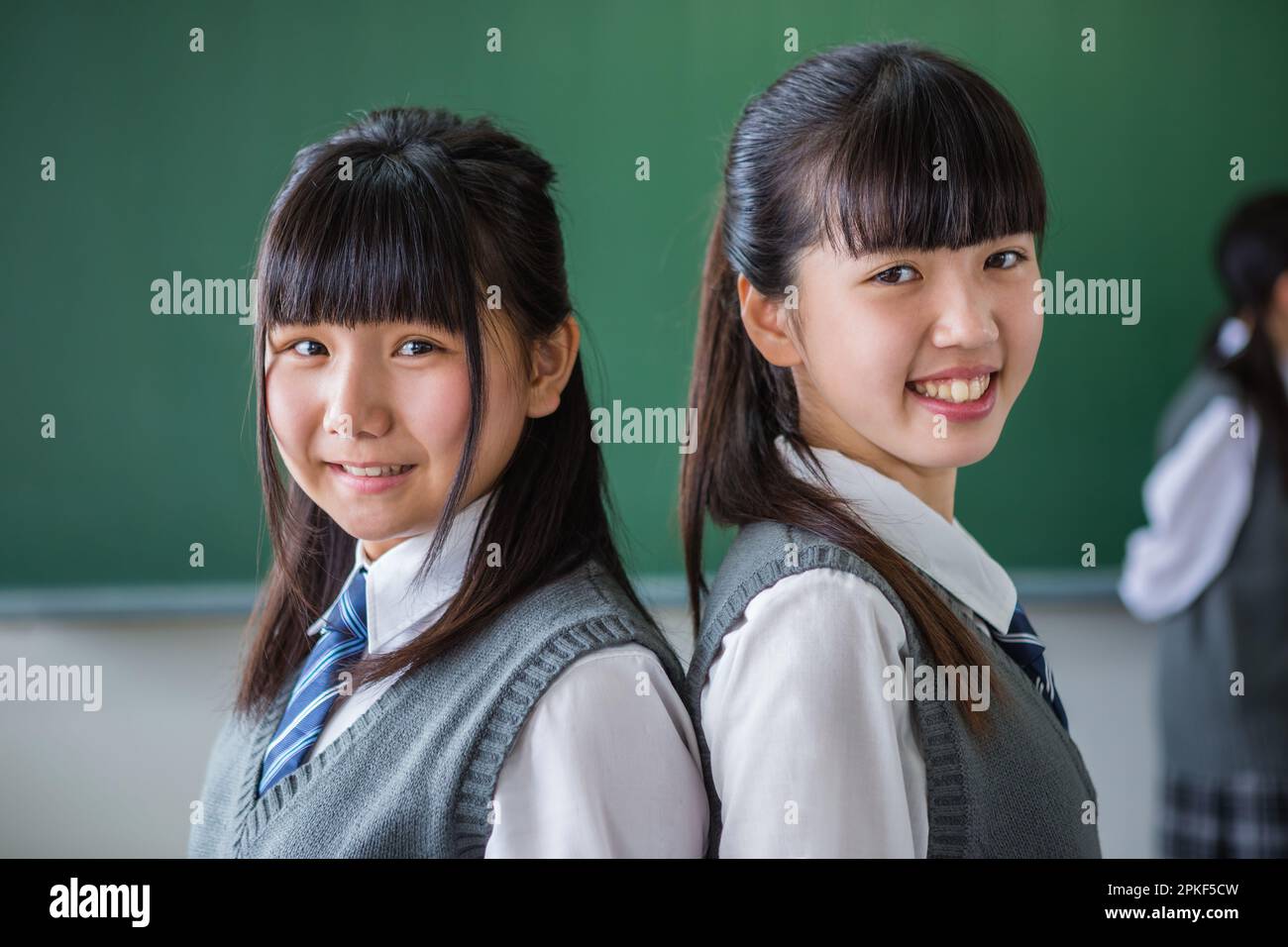 Junior high school girls getting along well with each other Stock Photo ...