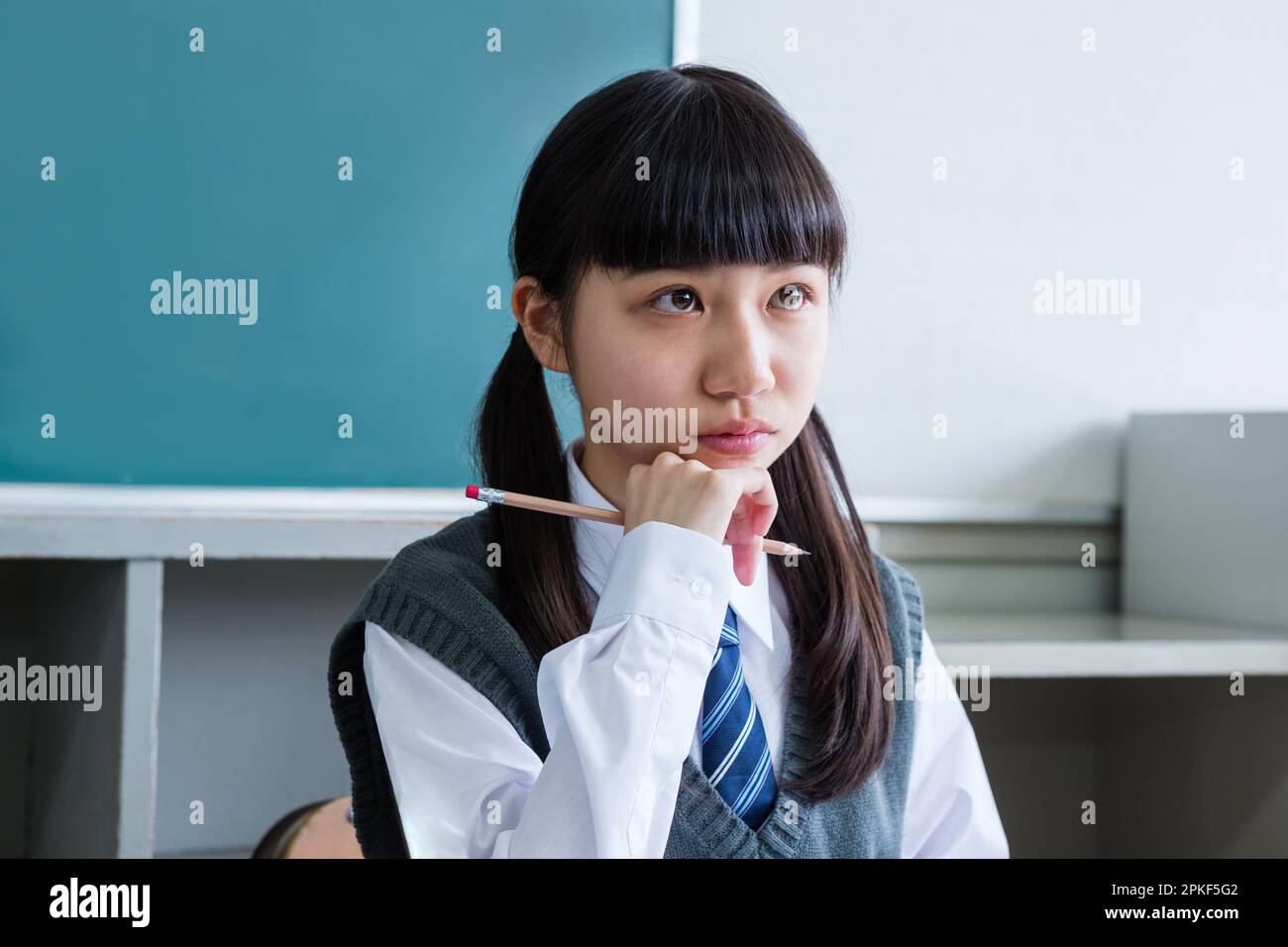 Junior high school girls taking a class Stock Photo - Alamy