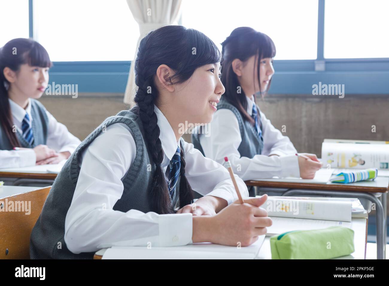 Junior high school girls taking a class Stock Photo - Alamy