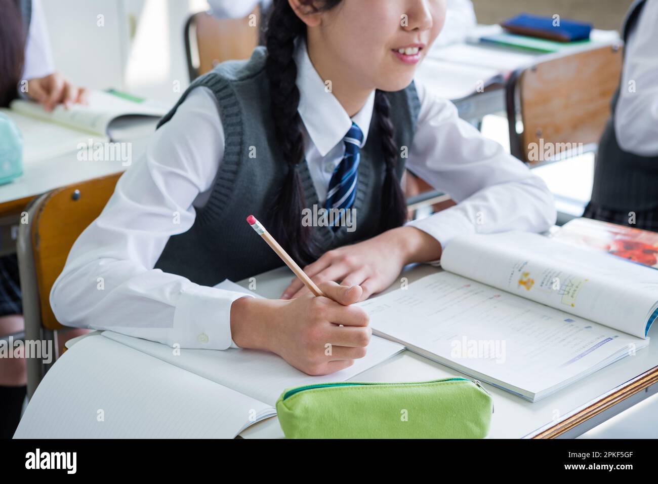 Junior high school girls taking a class Stock Photo - Alamy