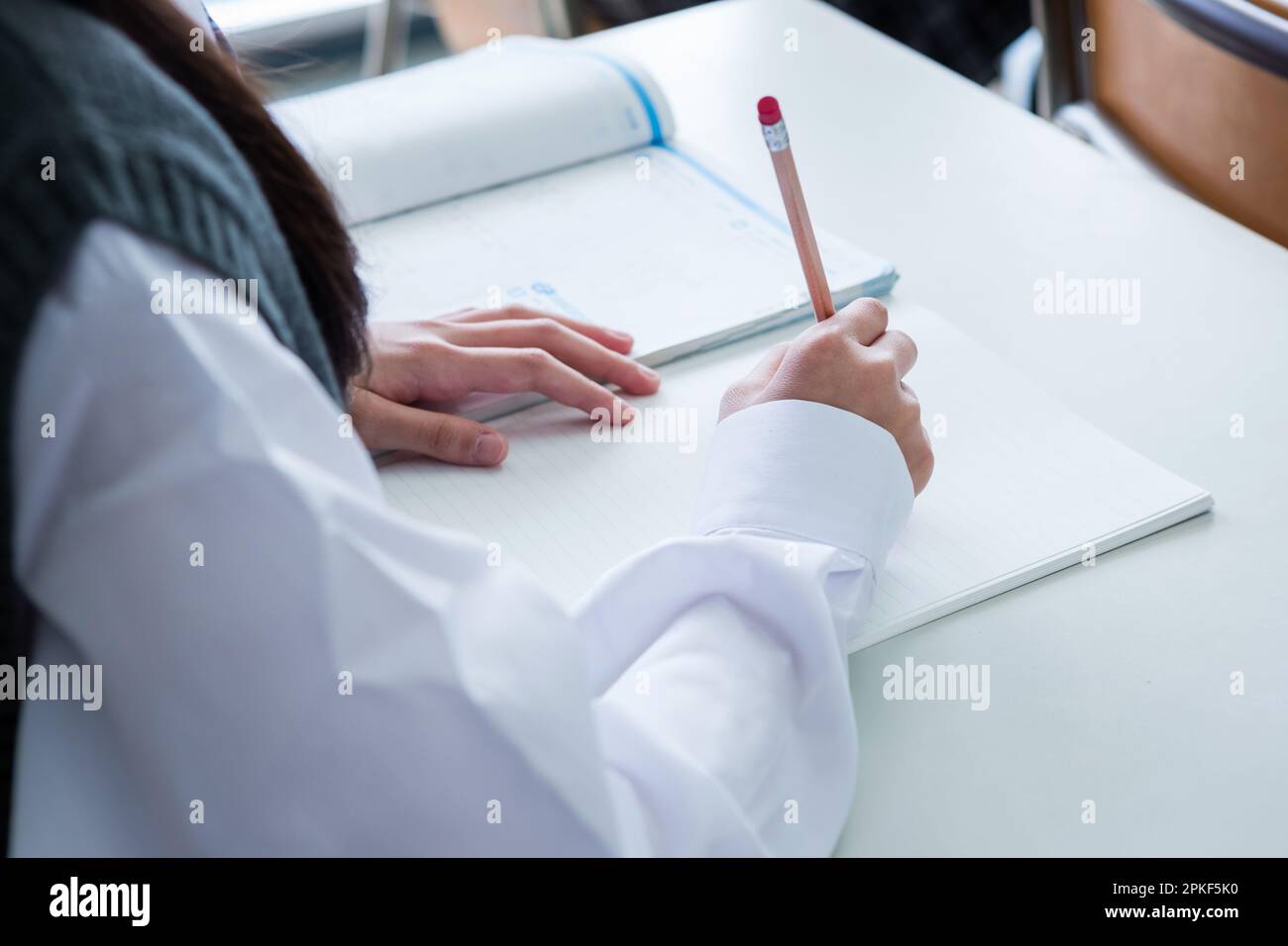Junior high school girls taking a class Stock Photo - Alamy