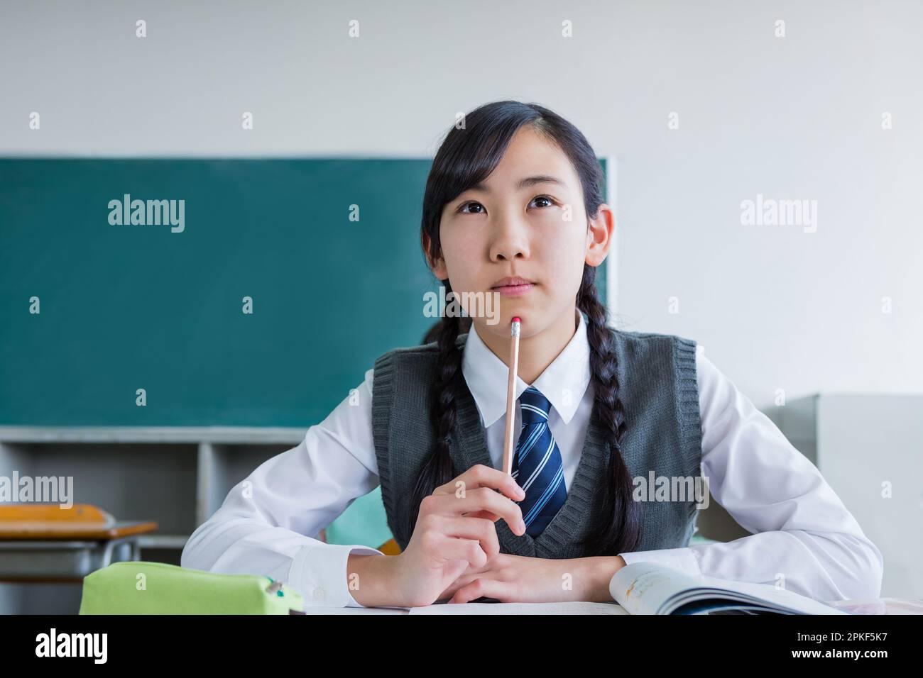 Junior high school girls taking a class Stock Photo - Alamy