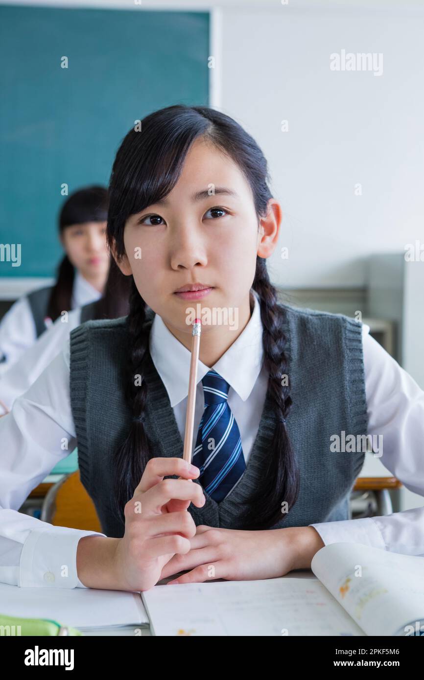 Junior high school girls taking a class Stock Photo - Alamy