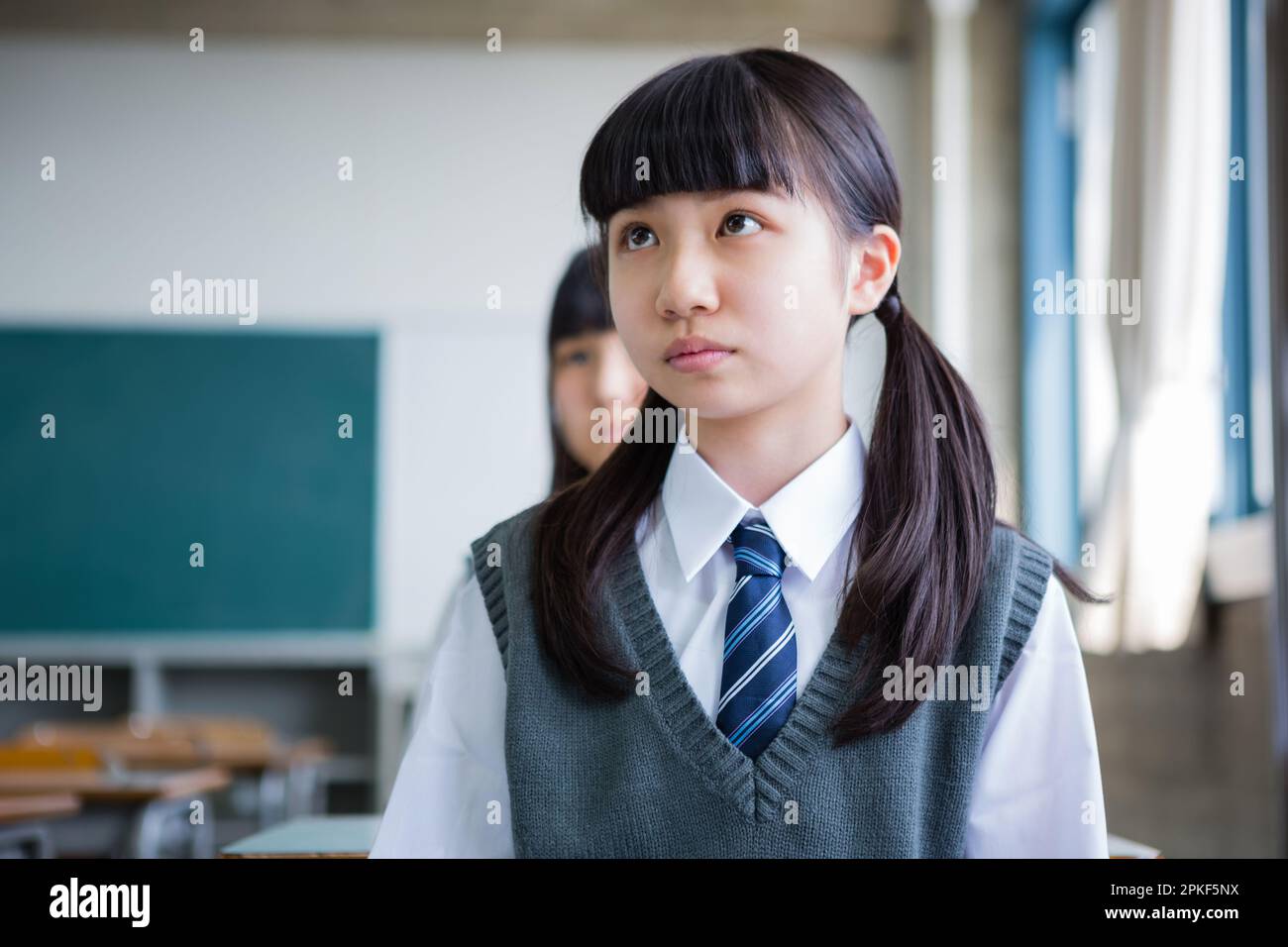 Junior high school girls taking a class Stock Photo - Alamy