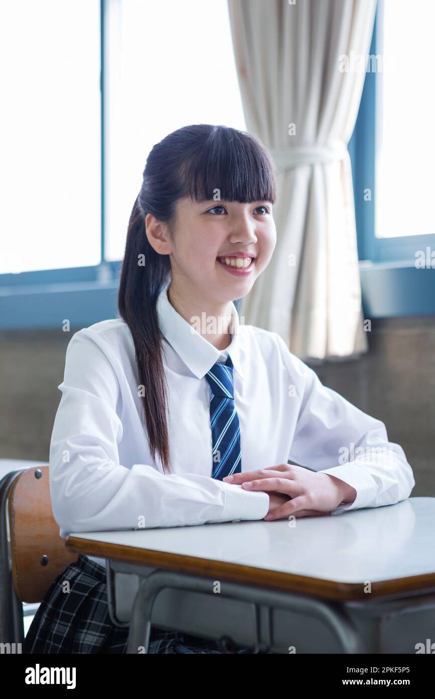 Junior high school girls taking a class Stock Photo - Alamy