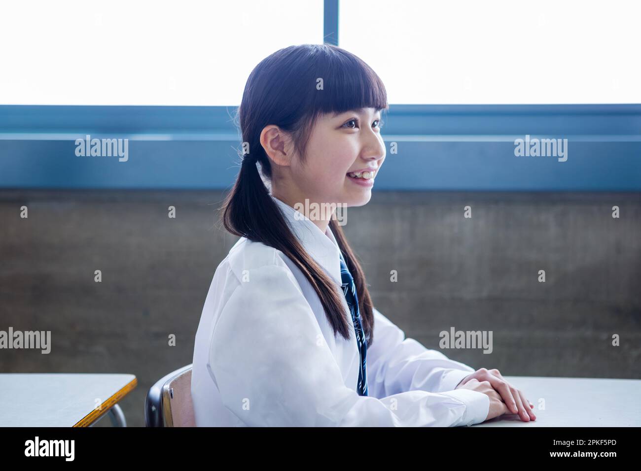 Junior high school girls taking a class Stock Photo - Alamy
