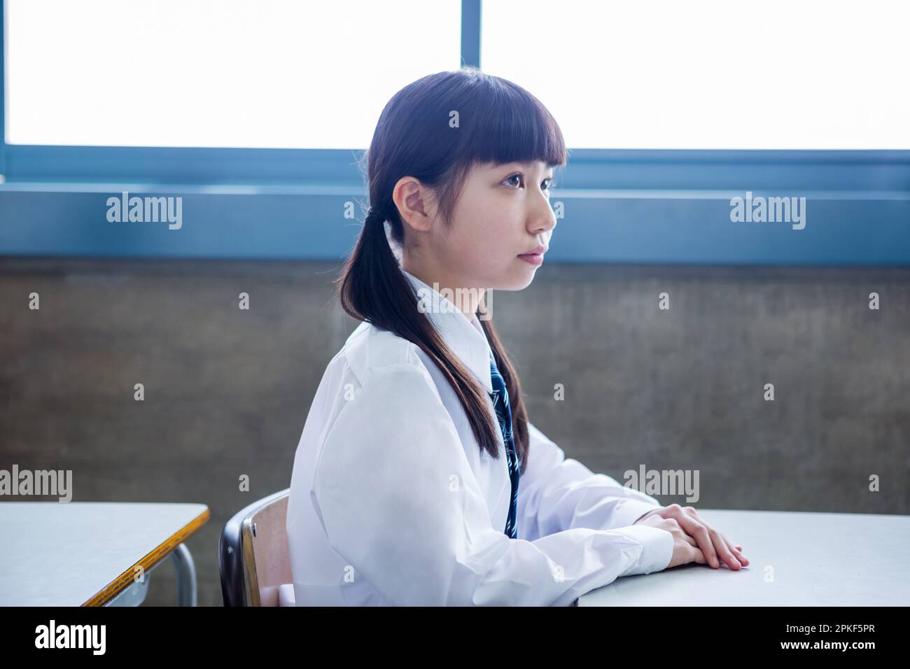 Junior high school girls taking a class Stock Photo - Alamy