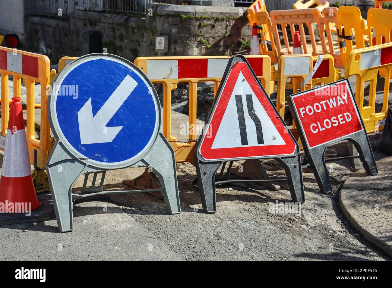 Three signs at once from a utility company making essential upgrades ...