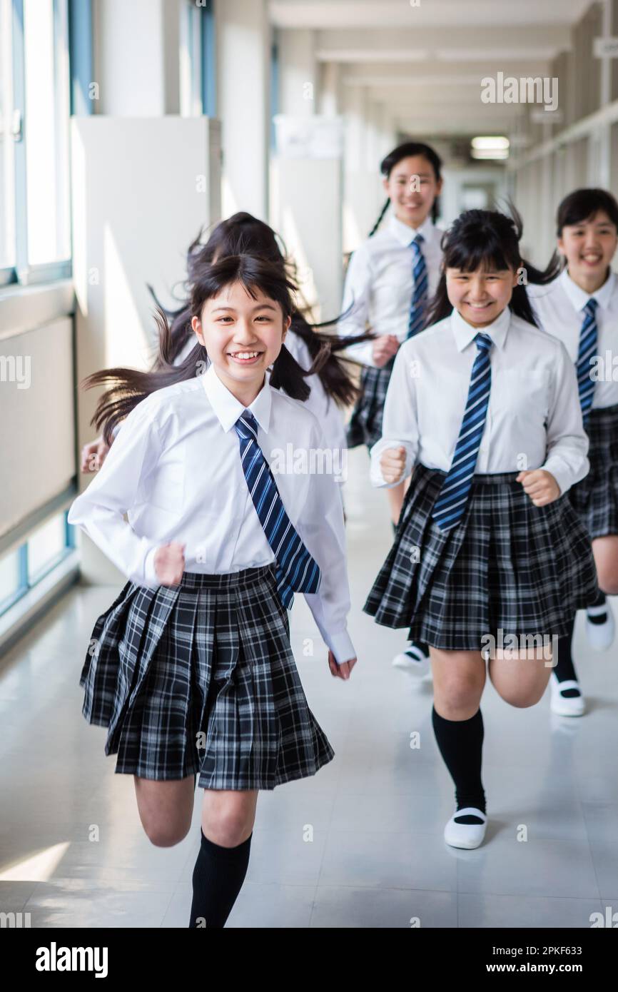 Junior High School Girl Running in the Hallway Stock Photo - Alamy