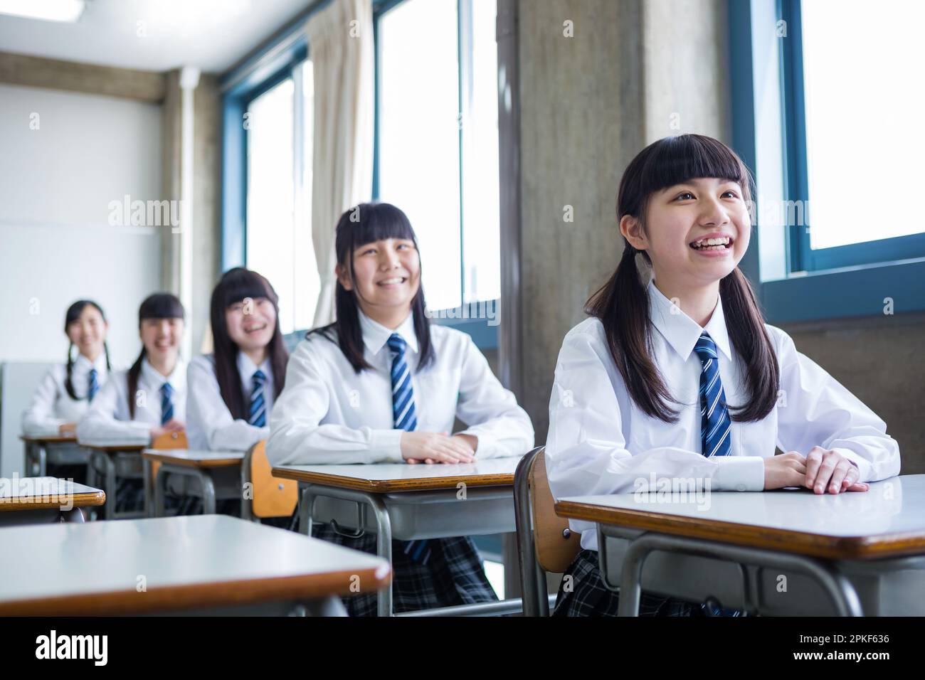 Junior high school girls taking a class Stock Photo - Alamy