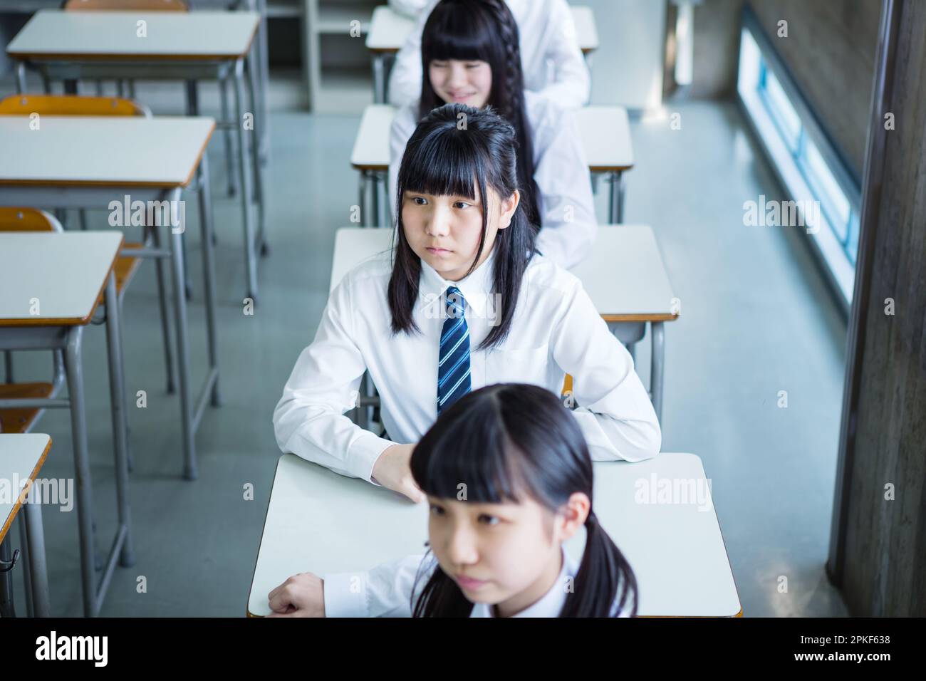 Junior high school girls taking a class Stock Photo - Alamy