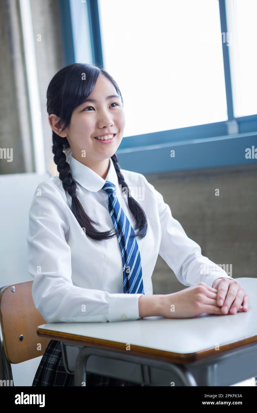 Junior high school girls taking a class Stock Photo - Alamy