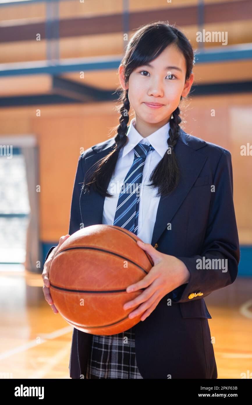 Junior High School Girl with a Basketball Stock Photo - Alamy
