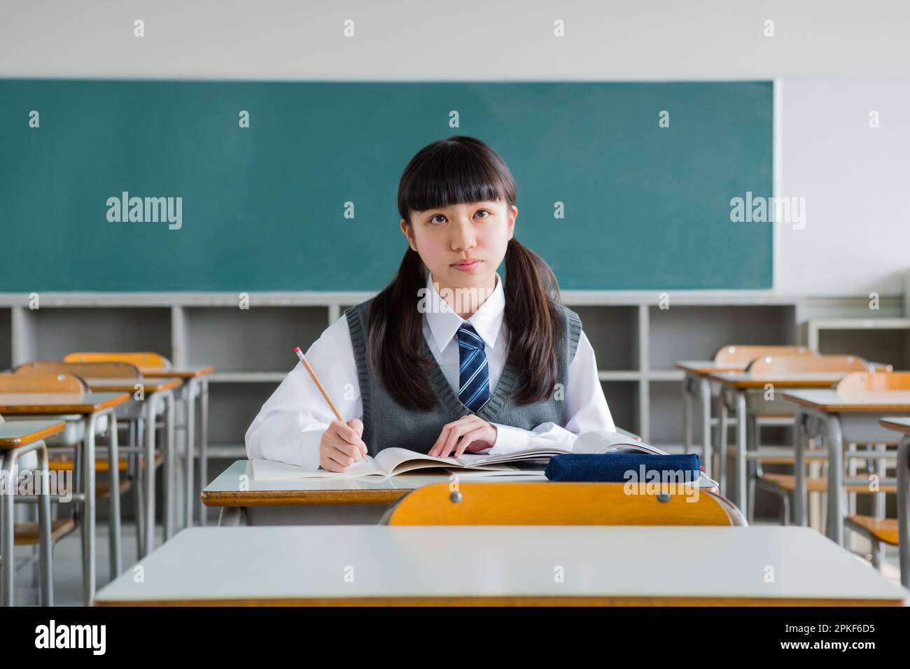 Junior high school girls studying in a classroom Stock Photo - Alamy