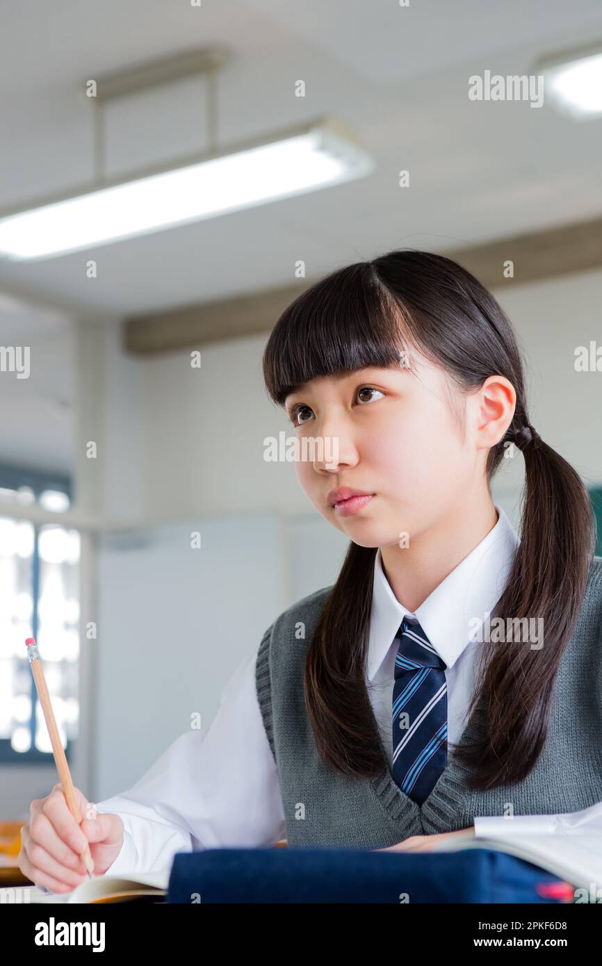 Junior high school girls studying in a classroom Stock Photo - Alamy