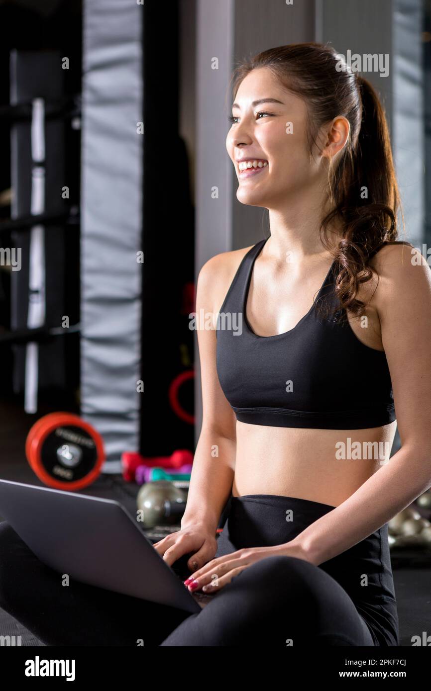 Women using computers at the gym Stock Photo - Alamy