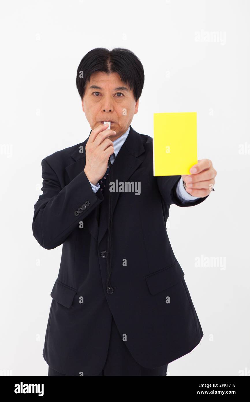 Man with yellow card Stock Photo - Alamy
