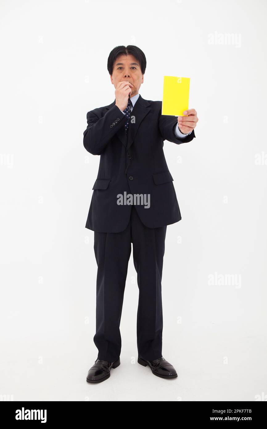 Man showing yellow card Stock Photo - Alamy