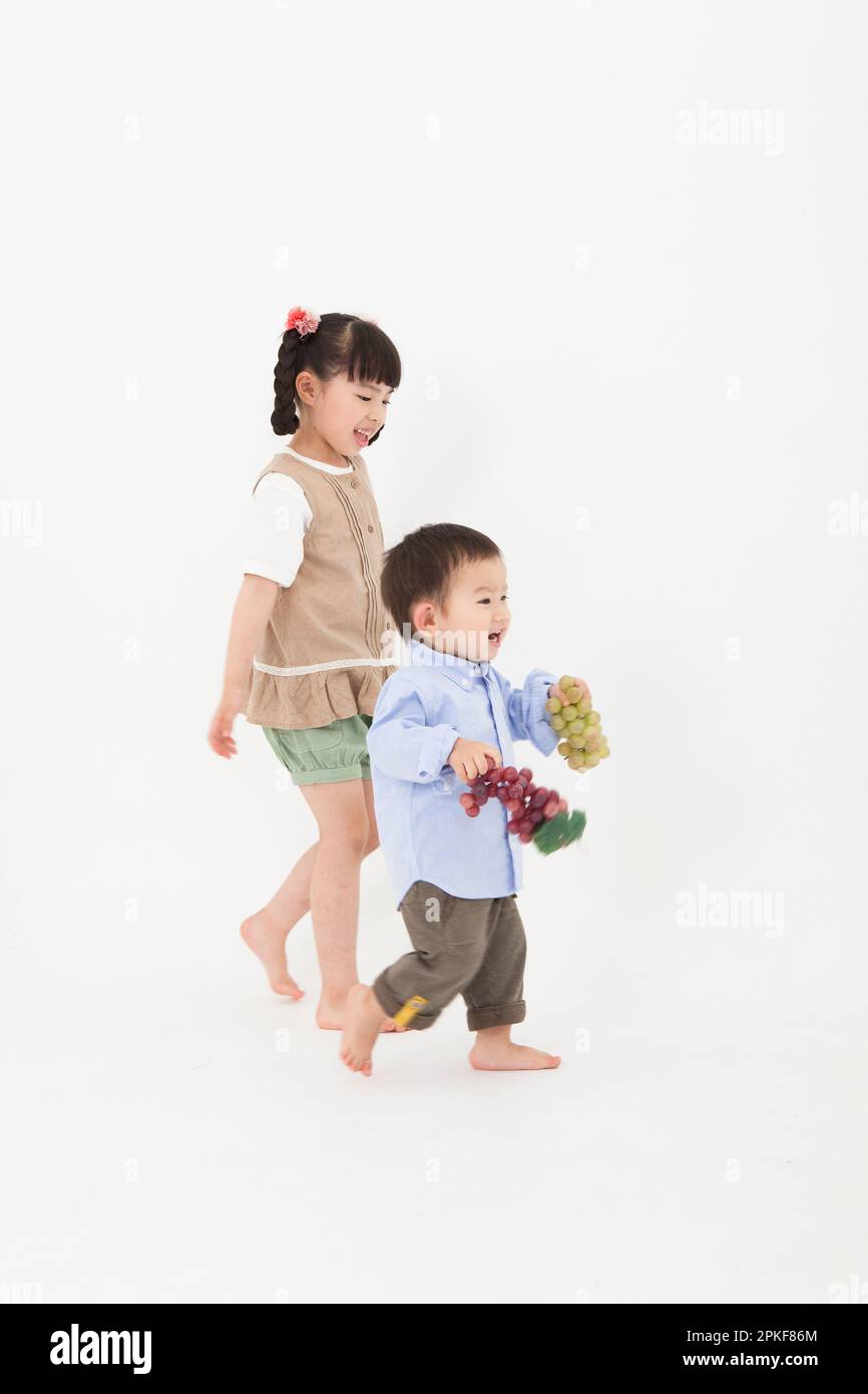 Boy and girl playing well Stock Photo - Alamy