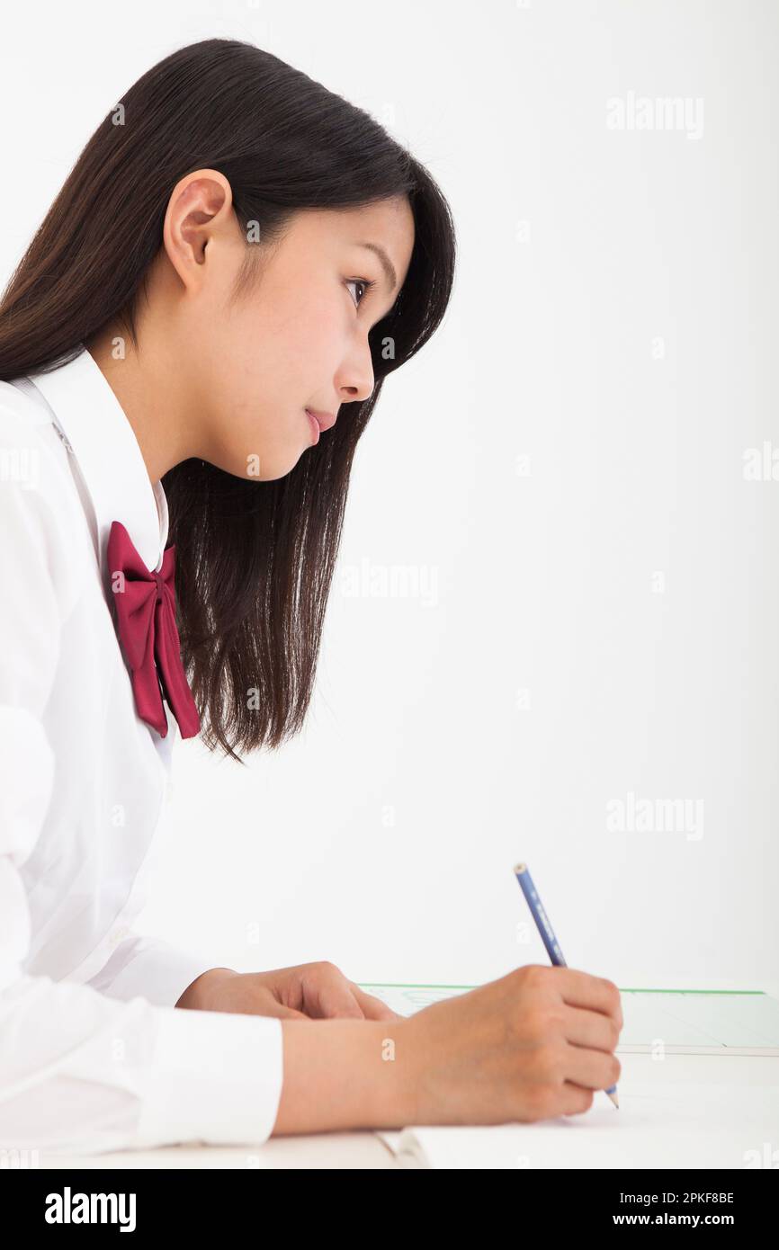 High school student taking notes Stock Photo - Alamy