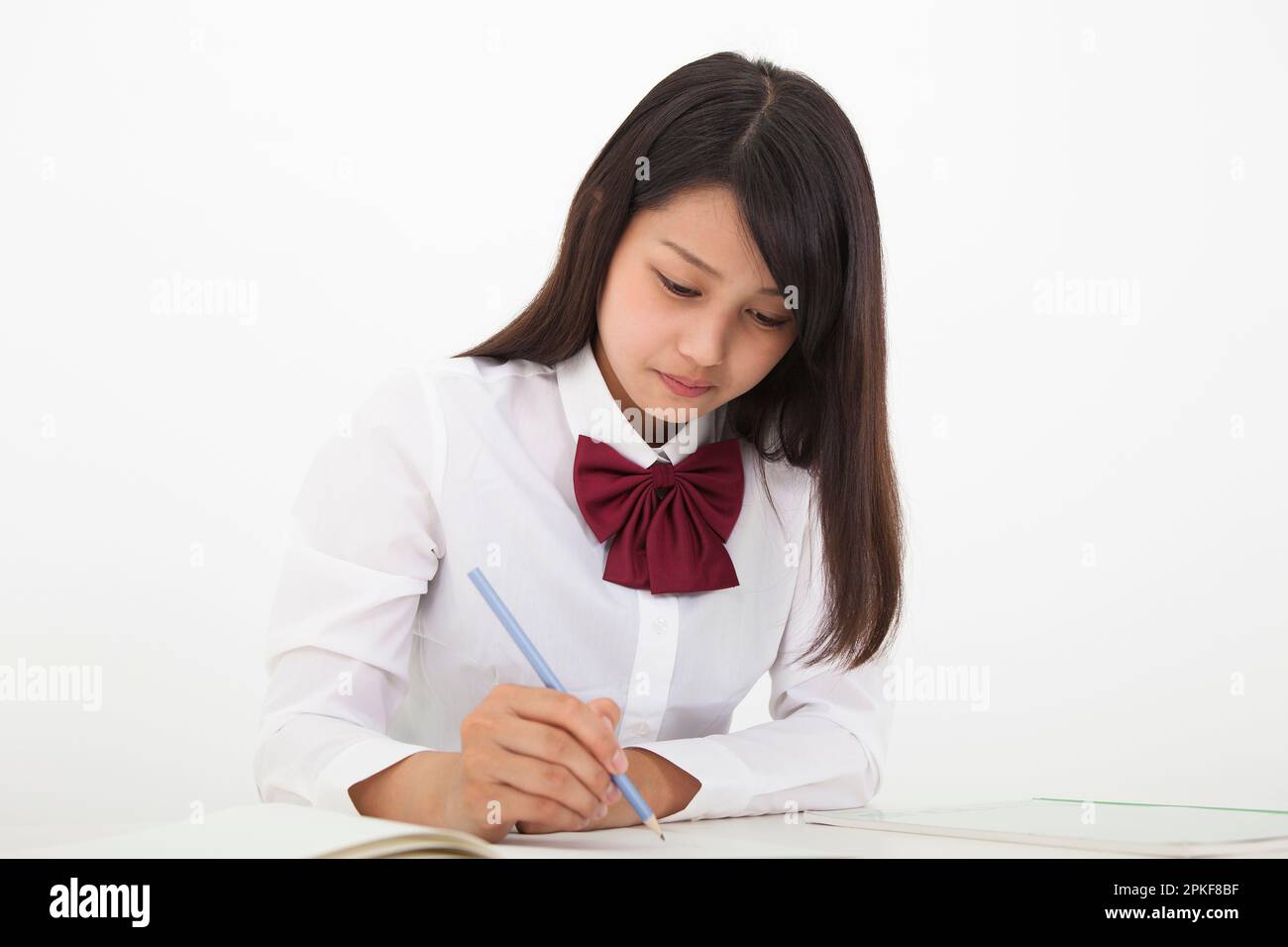 High school student taking notes Stock Photo - Alamy