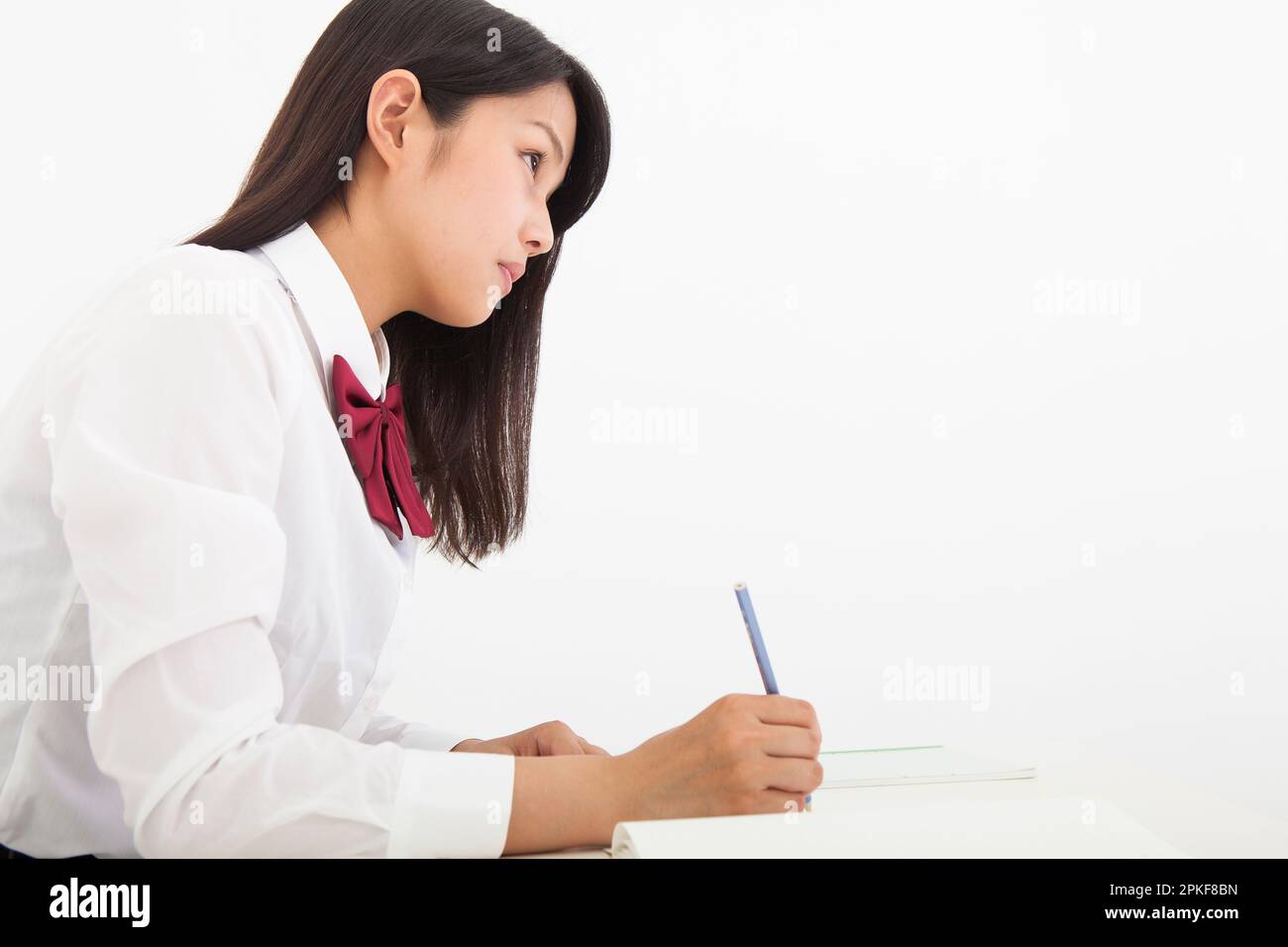High school student taking notes Stock Photo - Alamy