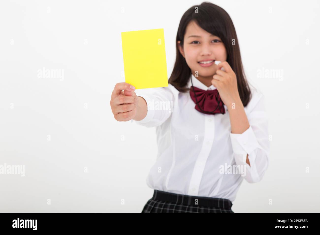 High school student giving a yellow card Stock Photo - Alamy