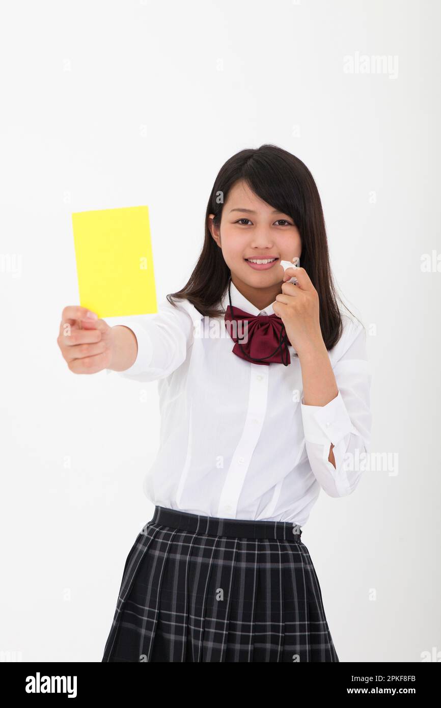 High school student giving a yellow card Stock Photo - Alamy
