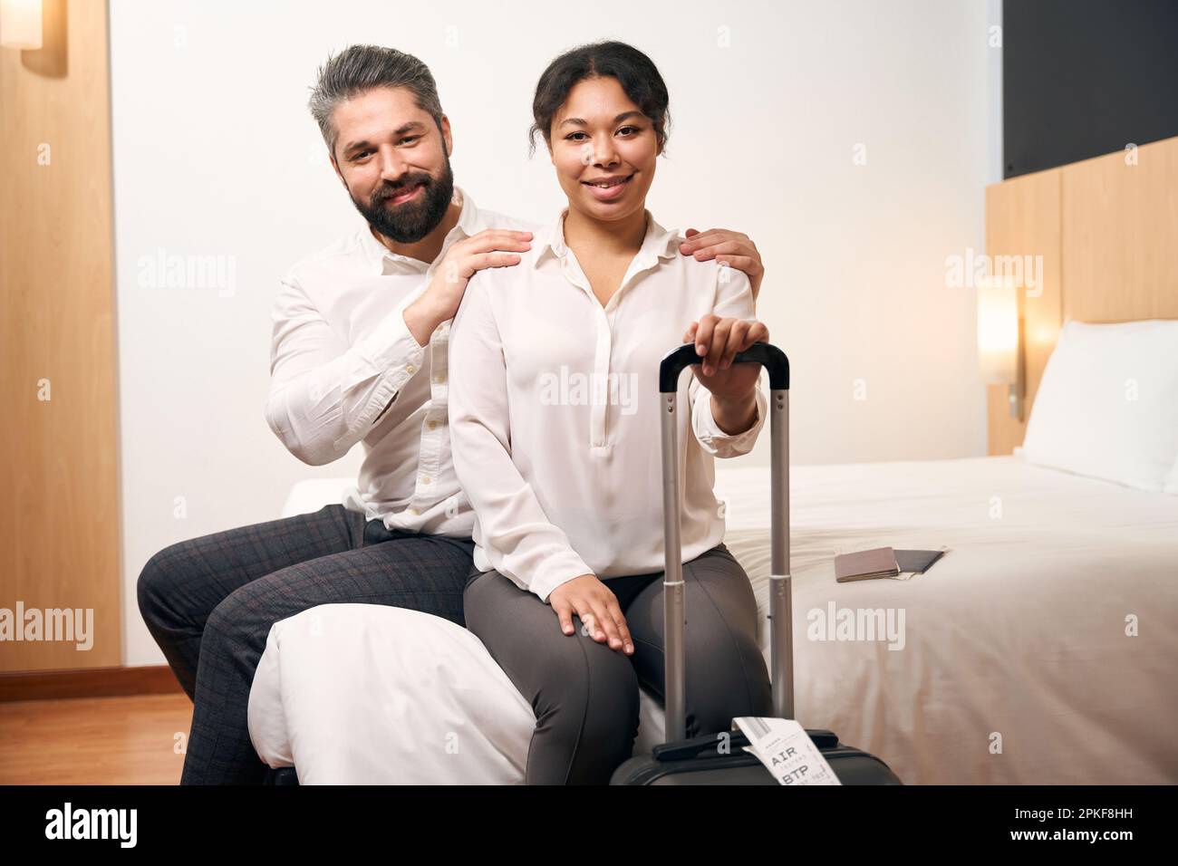 Romantic couple of tourists in hotel room Stock Photo - Alamy