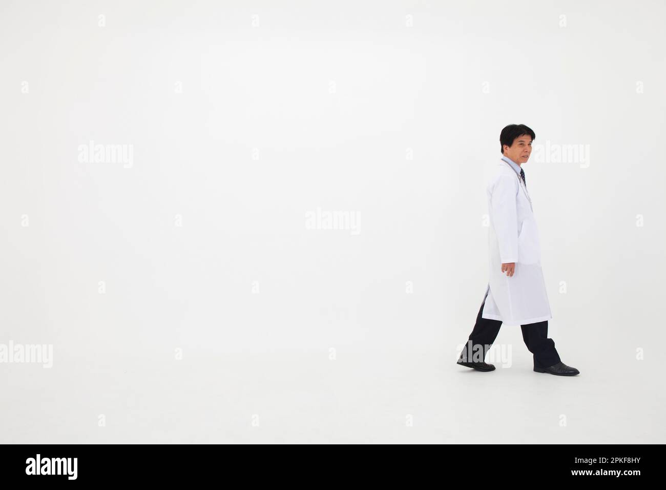 Man in white Stock Photo - Alamy