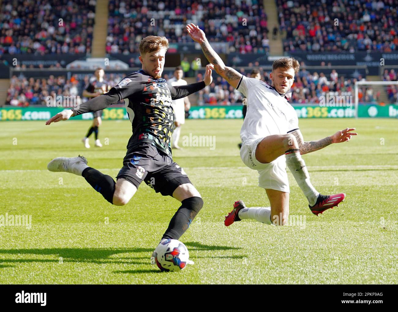 Coventry City's Josh Eccles (left) and Swansea City's Jamie Paterson ...