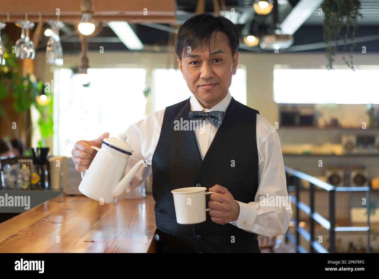 A male waiter making coffee Stock Photo - Alamy
