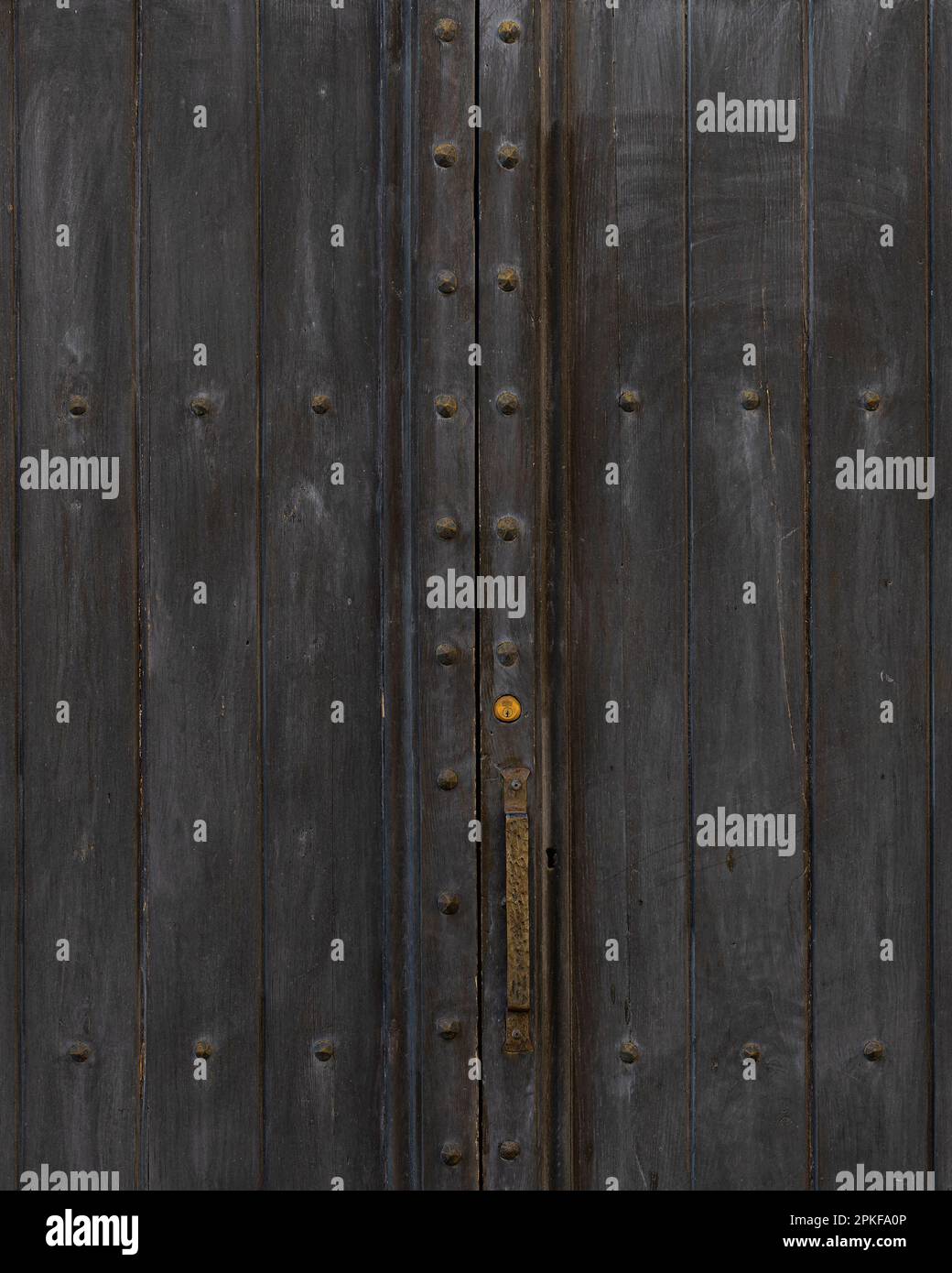 Black double doors with a rusty handle and new lock in Tuscany Stock ...