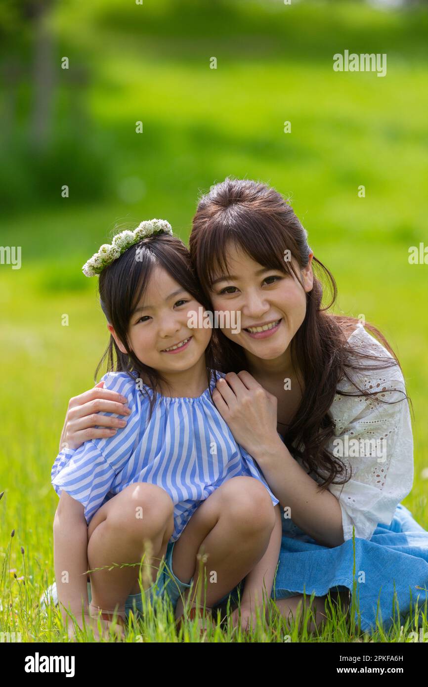Crouching on grass hi-res stock photography and images - Alamy