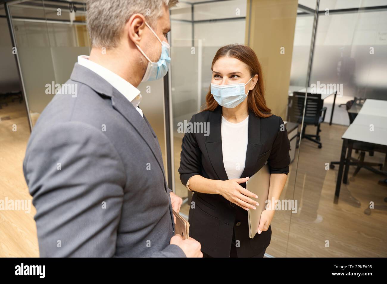 Director and employee talking during break between work Stock Photo - Alamy