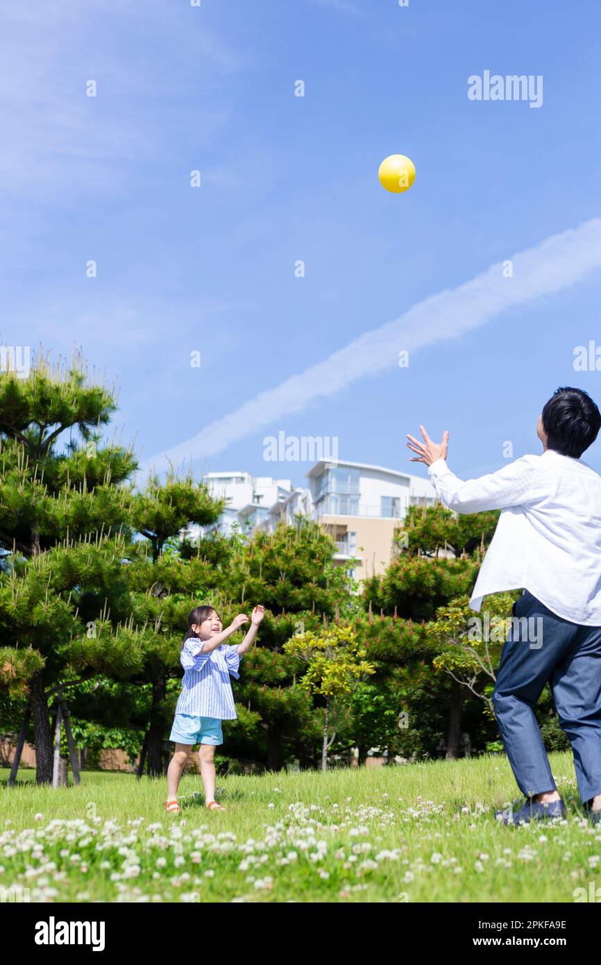 Parent and Child Playing with a Ball Stock Photo - Alamy