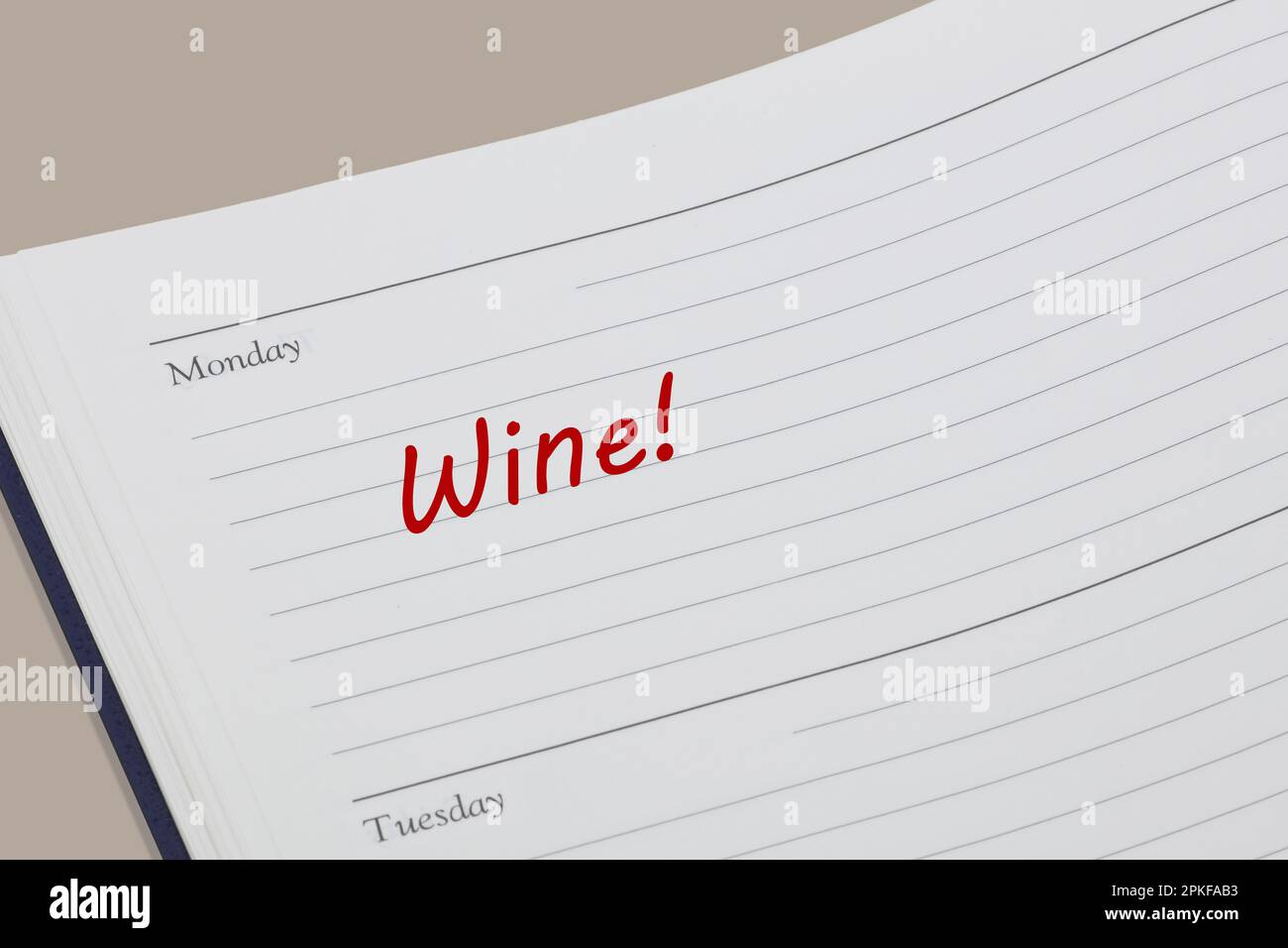 Wine reminder note in red ink in a diary page Stock Photo - Alamy