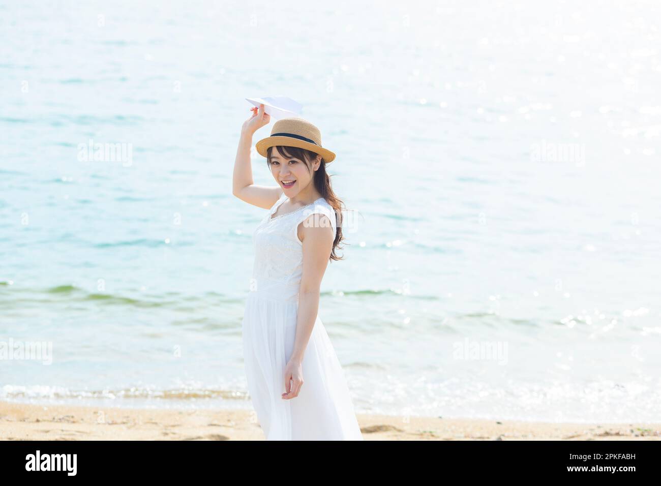 Woman flying paper plane Stock Photo - Alamy