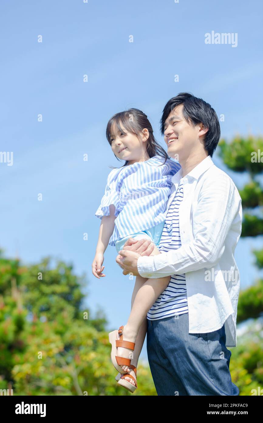 Father carrying his daughter Stock Photo - Alamy
