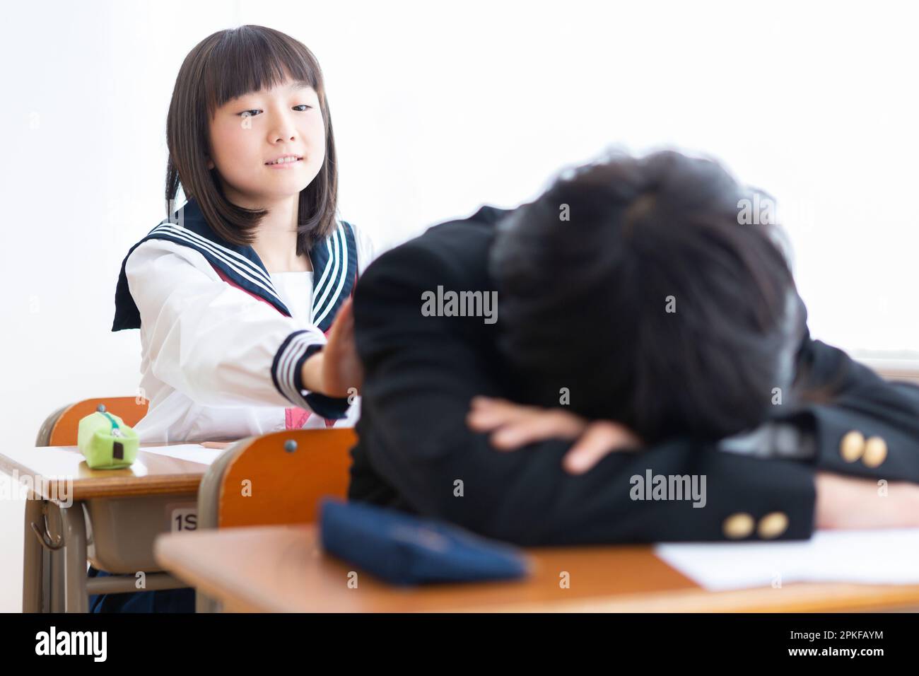 Snoozing junior high school students Stock Photo - Alamy