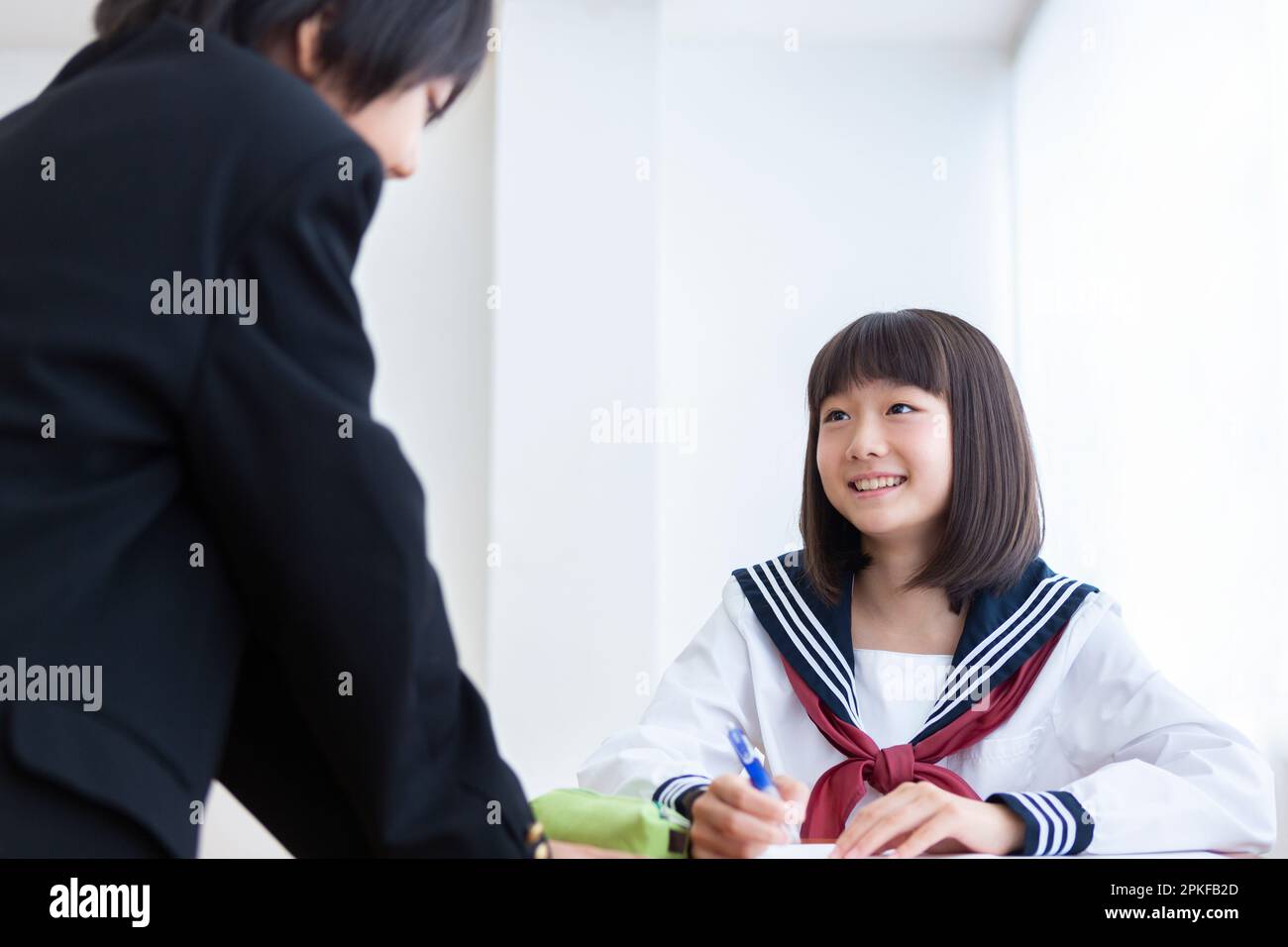 Junior high school students having a conversation Stock Photo - Alamy